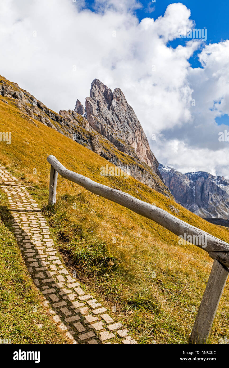 Path and wooden rail in the Dolomites, South Tyrol, Italy Stock Photo ...