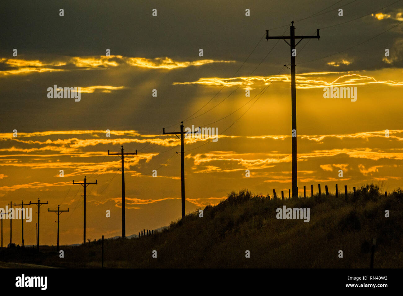 Power lines at sunset Stock Photo - Alamy