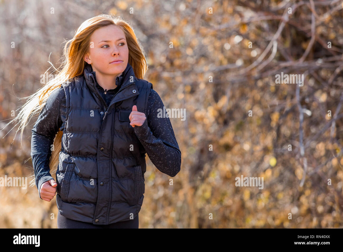 Teenage girl jogging Stock Photo - Alamy