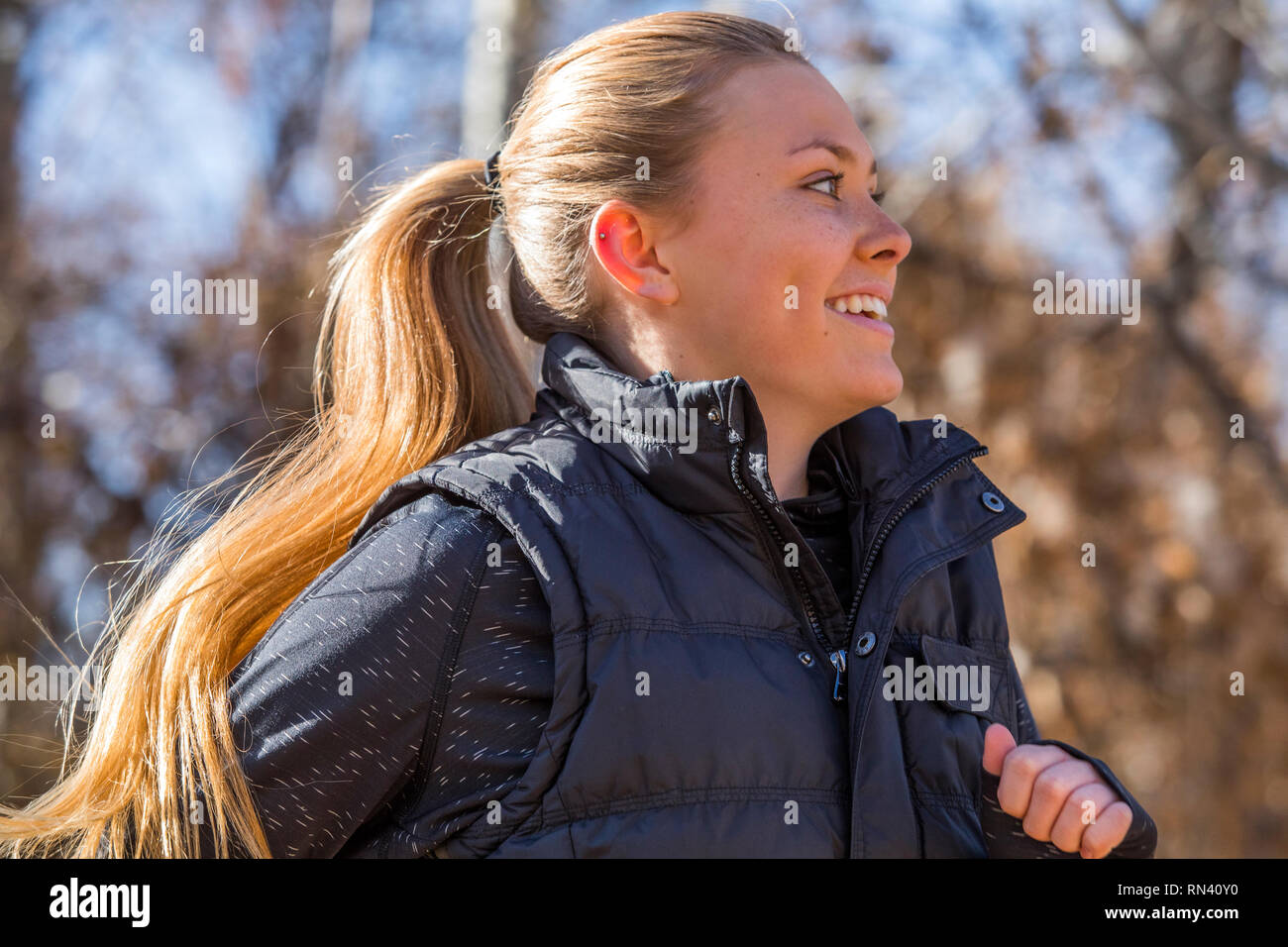 Teenage girl jogging Stock Photo - Alamy