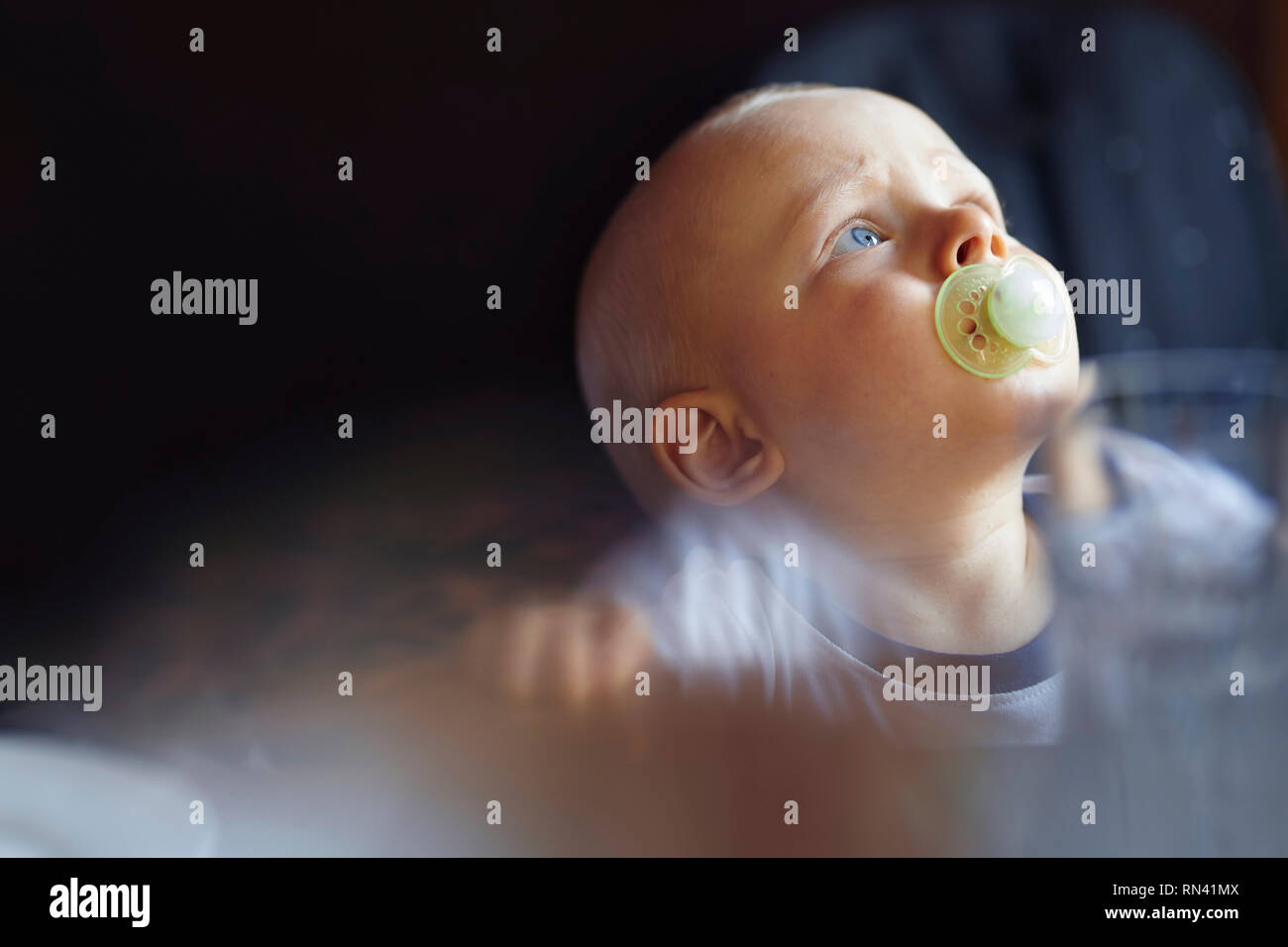 Baby boy with pacifier Stock Photo - Alamy
