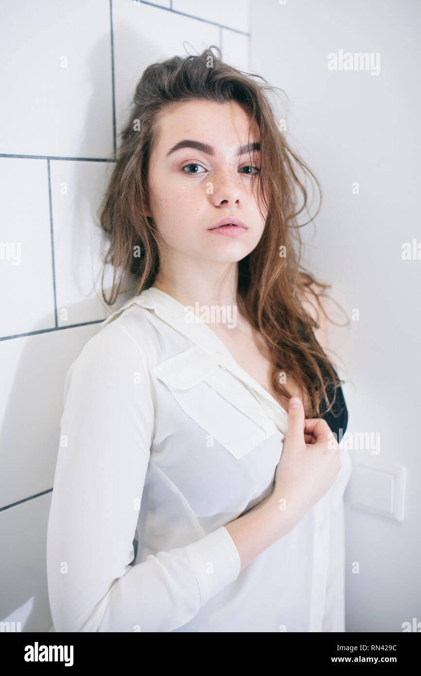 Leaning on tiled wall hi-res stock photography and images - Alamy