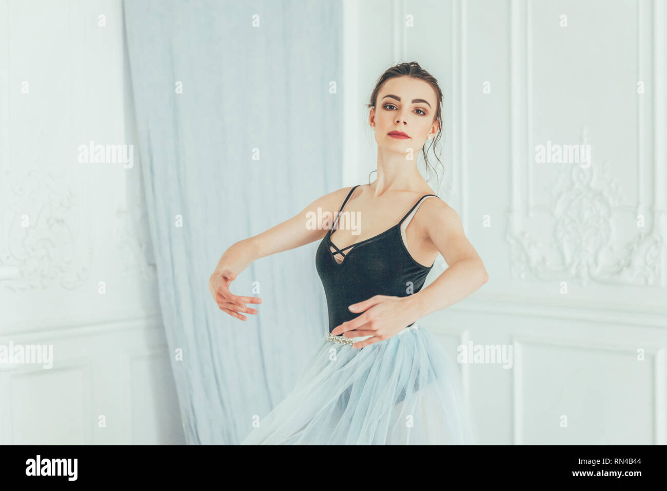 Young classical ballet dancer woman in dance class. Beautiful graceful ...