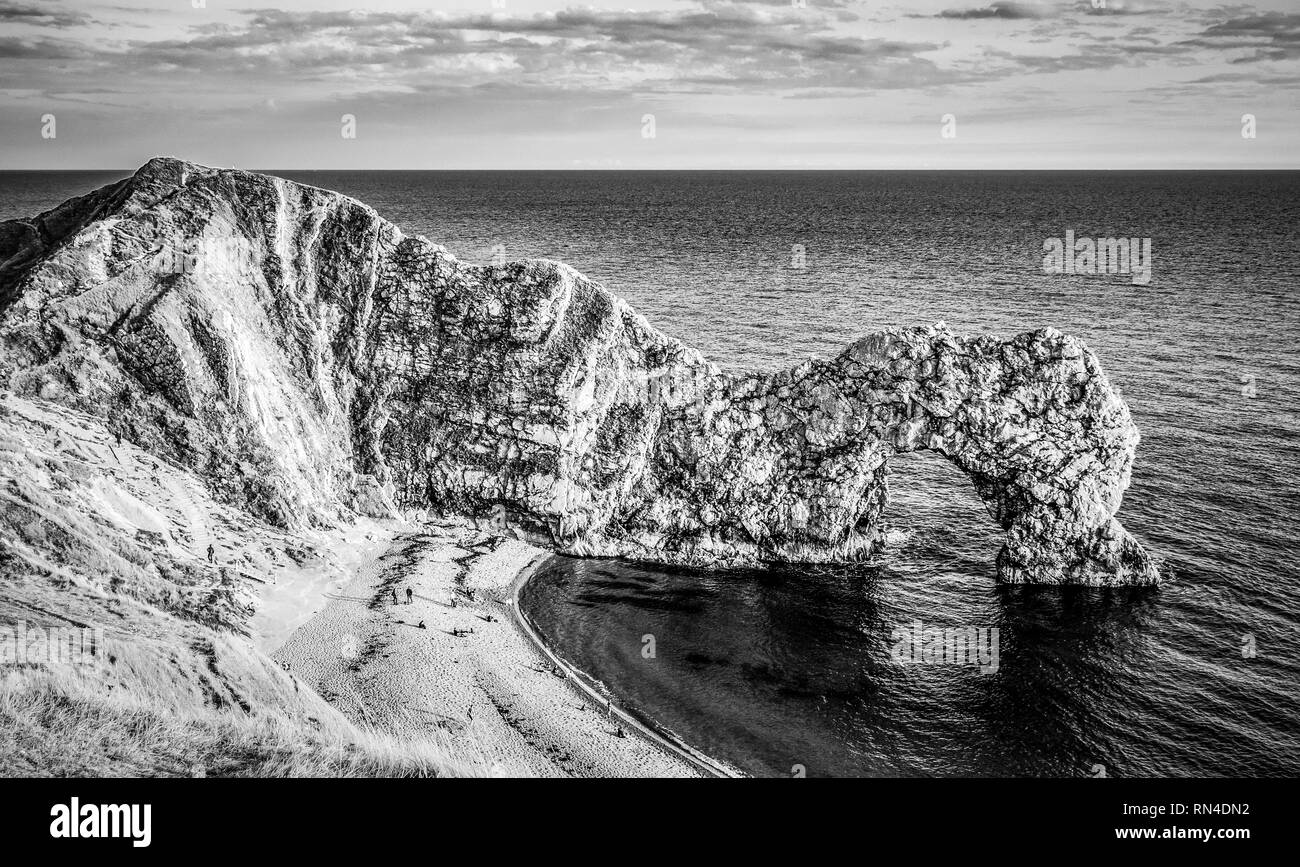 Sunset over Durdle Door - the most famous landmark in Devon England ...