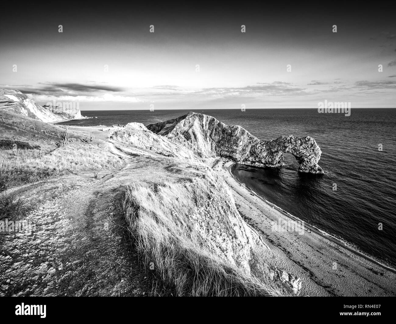 Sunset over Durdle Door - the most famous landmark in Devon England ...