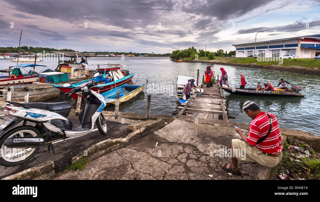 Labuan People at small jetty Stock Photo - Alamy