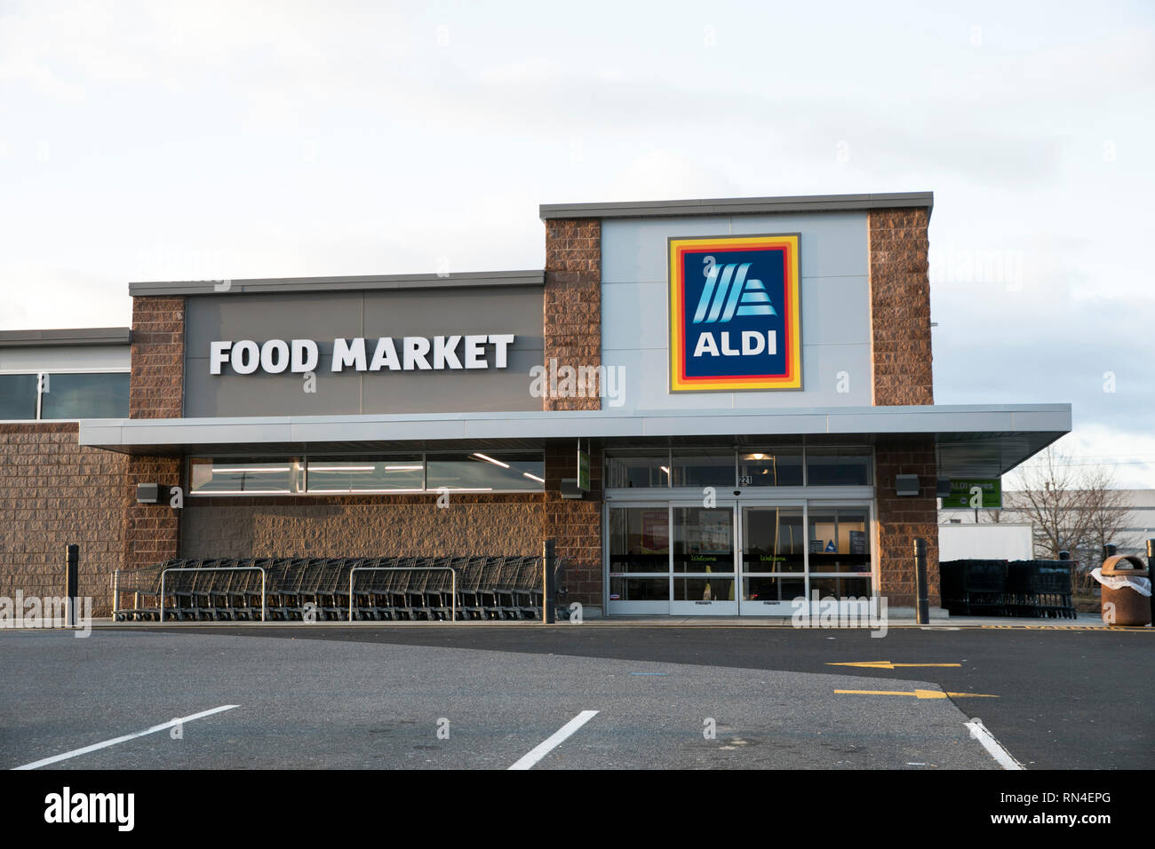 A logo sign outside of a Aldi retail grocery store in Winchester ...