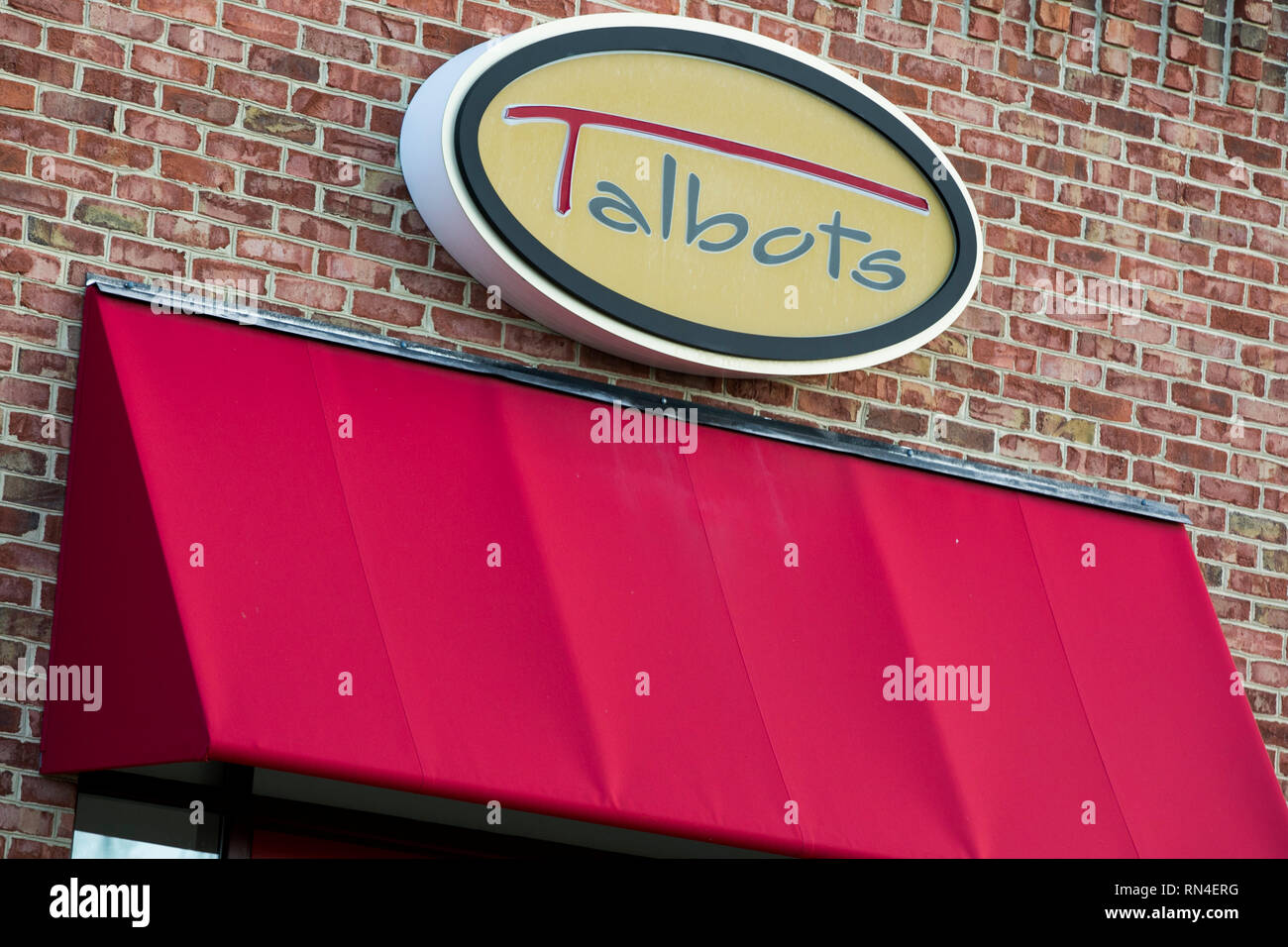 A logo sign outside of a Talbots retail store location in Winchester ...