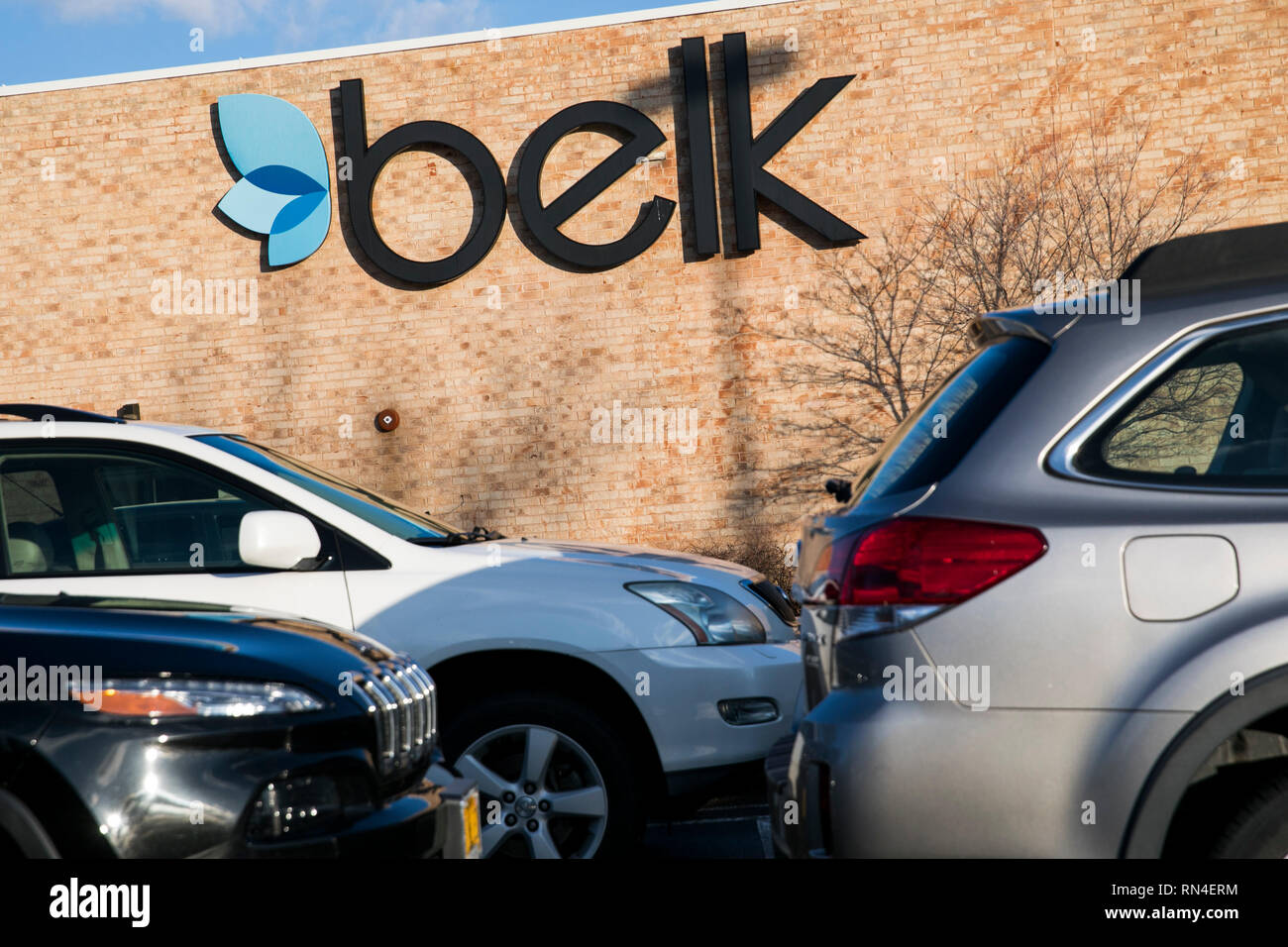 A logo sign outside of a Belk retail store location in Winchester ...