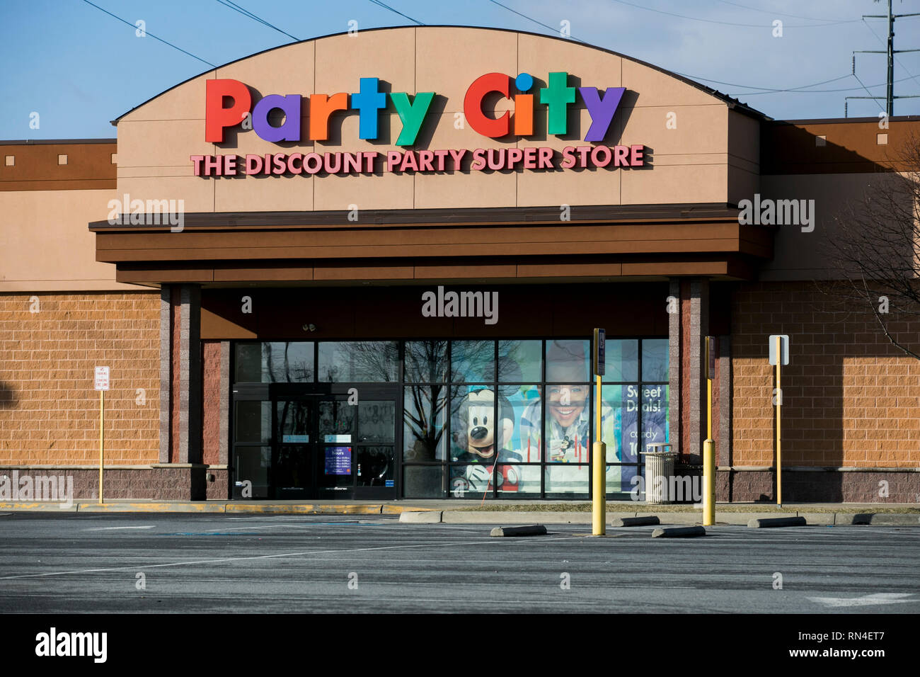 A logo sign outside of a Party City retail store location in Winchester ...