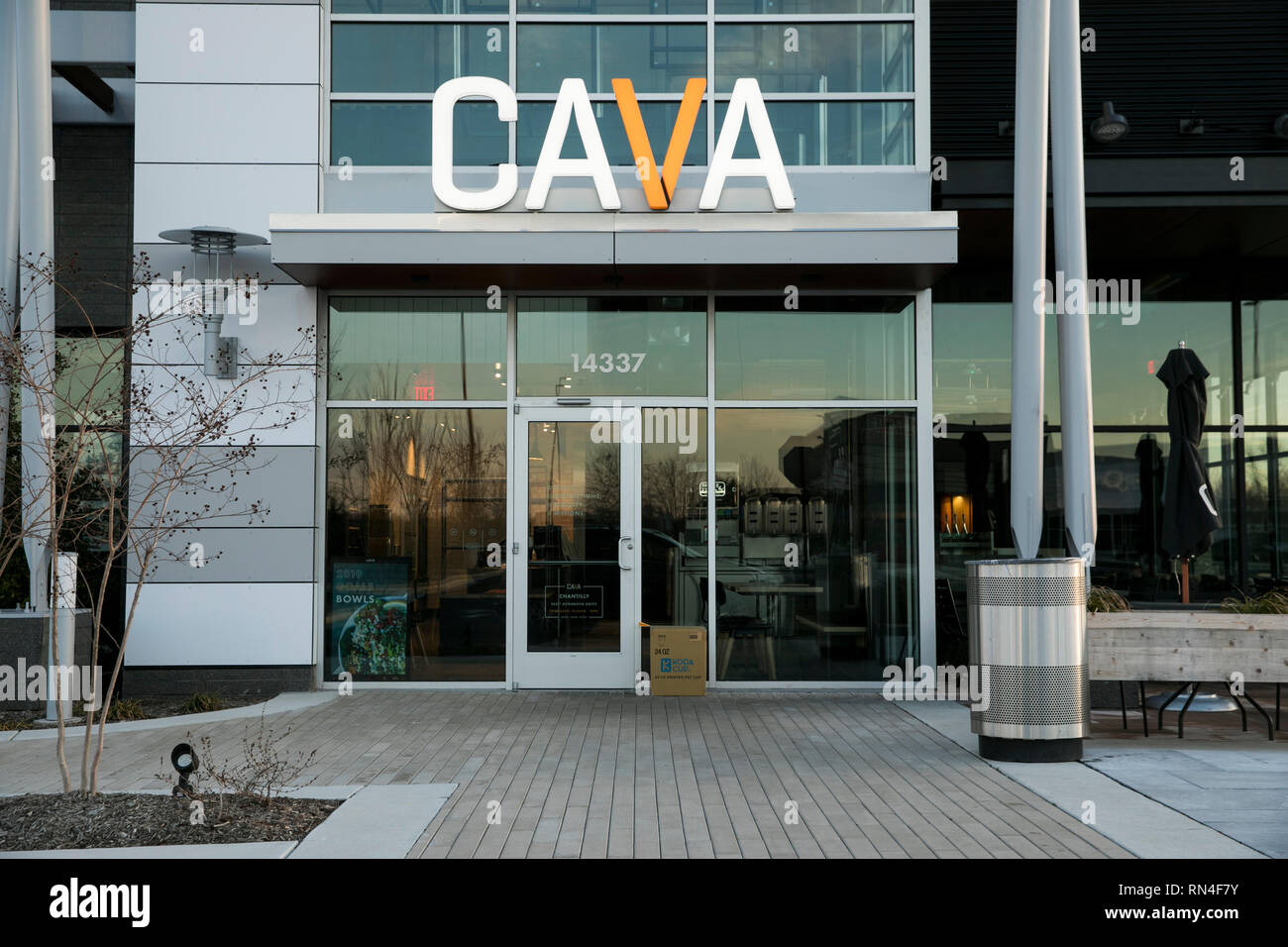 A logo sign outside of a Cava restaurant location in Chantilly ...