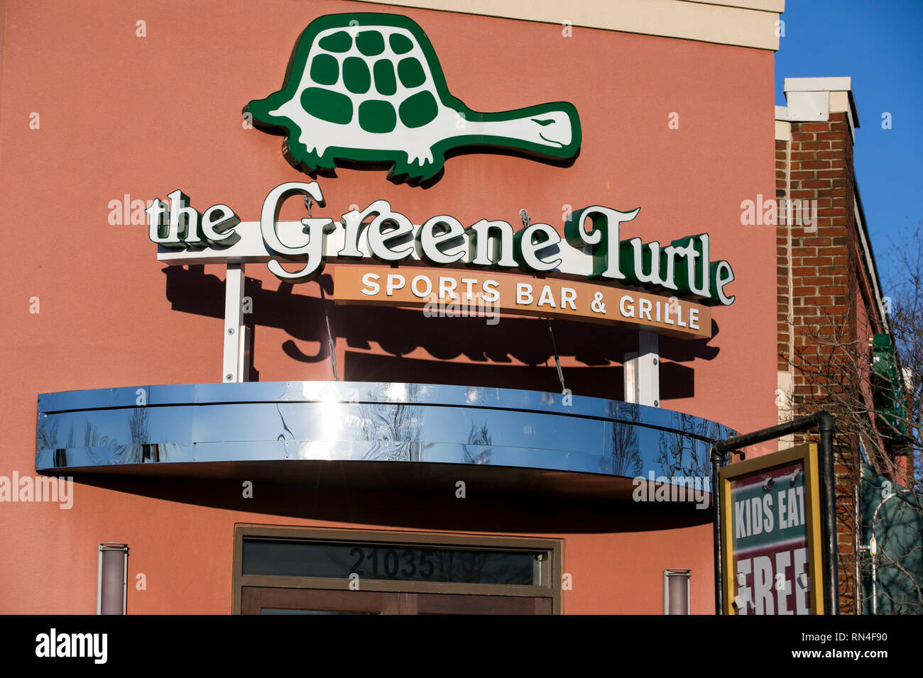 A logo sign outside of a The Green Turtle restaurant location in Dulles ...
