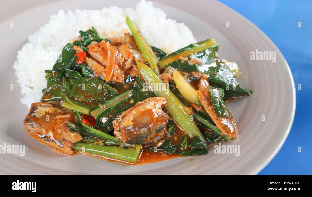 stir-fried kale with tinned fish and rice dish Stock Photo - Alamy