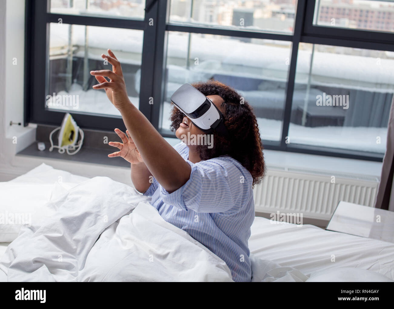 attractive Afro girl interacting with a virtual features, imaginable ...