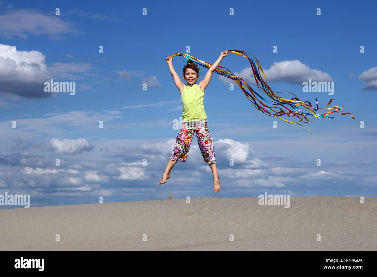 Child jump sand hi-res stock photography and images - Alamy