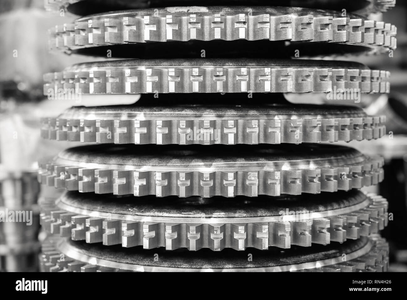 Large metal gears. New parts in stock. Industrial background Stock ...