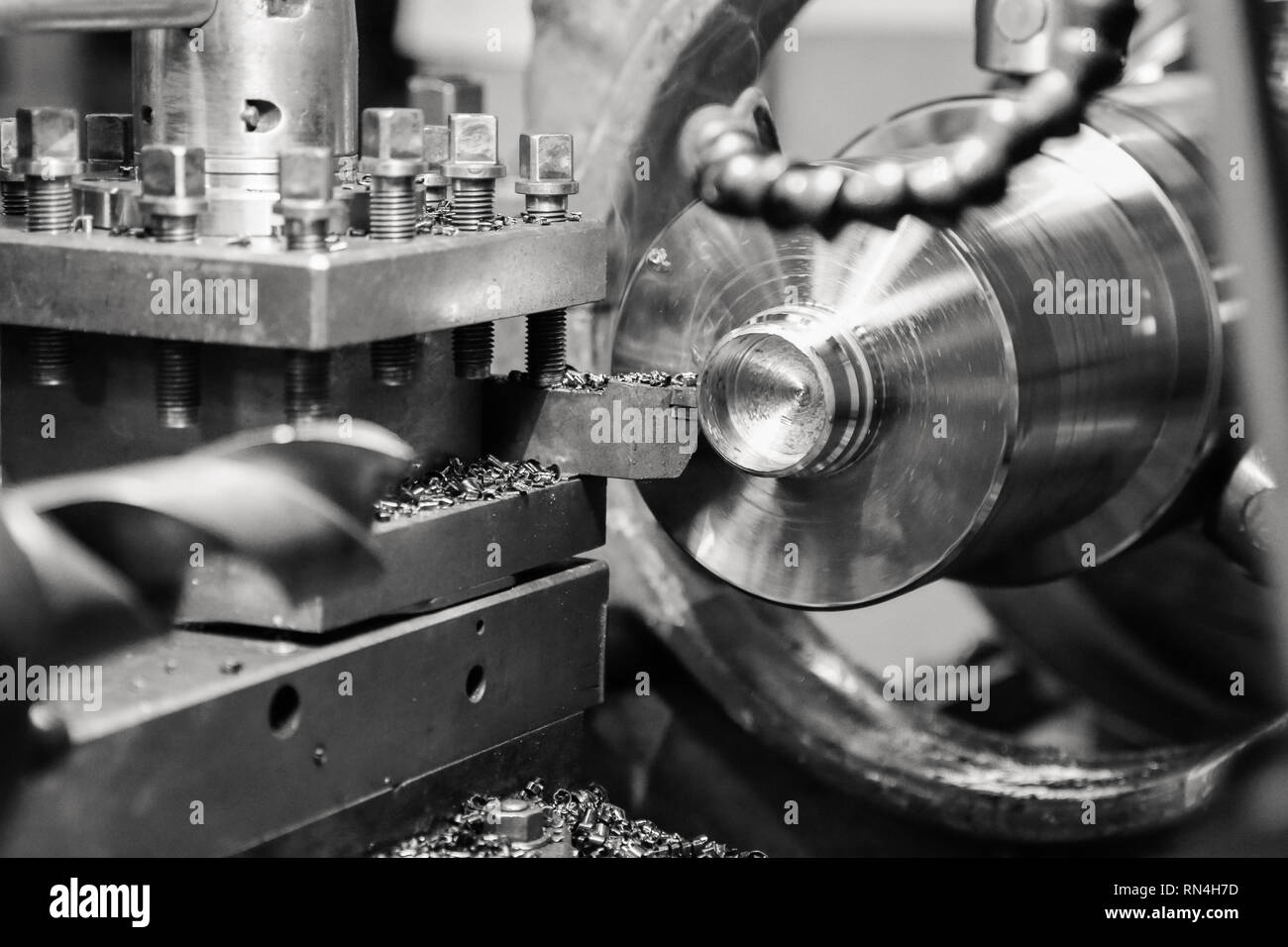 CNC lathe processes metal part. Automated production Stock Photo - Alamy