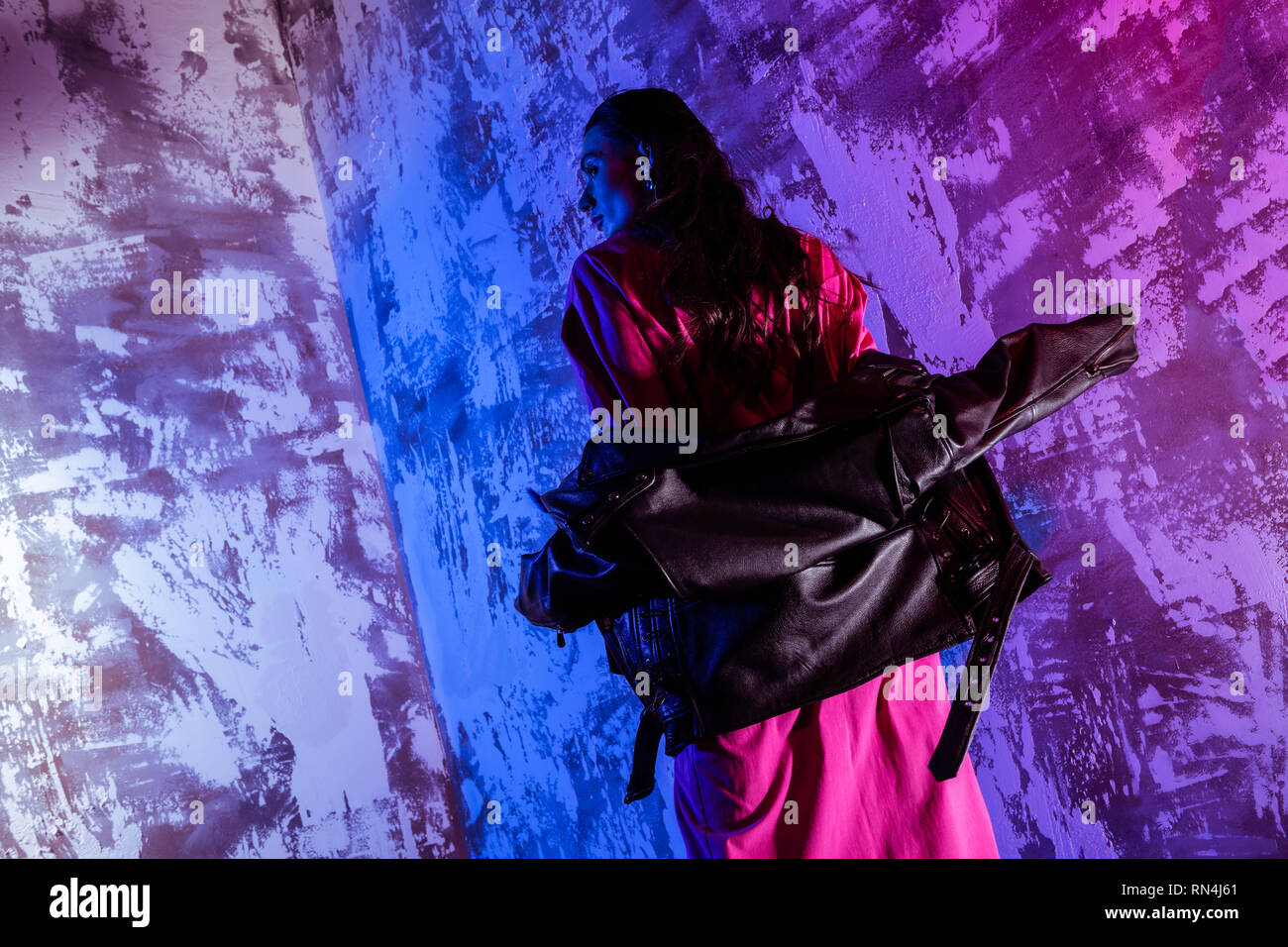 Nice young woman turning her back to you Stock Photo - Alamy