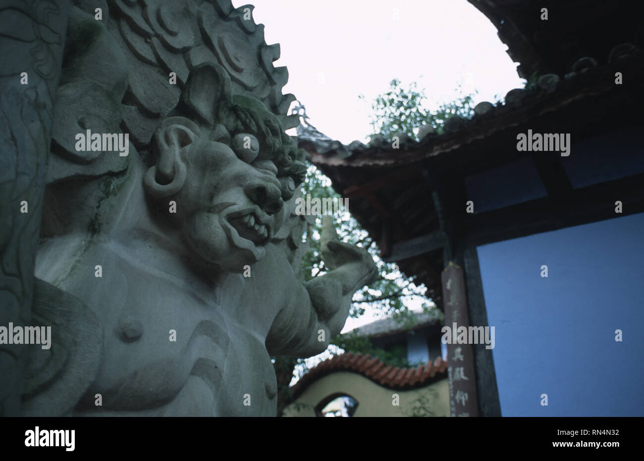 Caption: Fengdu, China - Nov 2002. Dragon and demon figures lining the ...