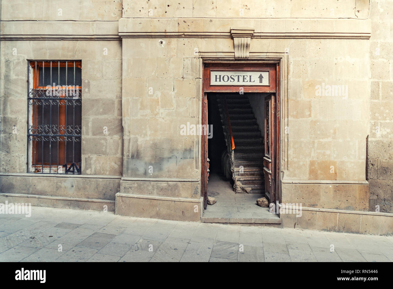 Vintage wooden door, entrance to old hostel Stock Photo - Alamy