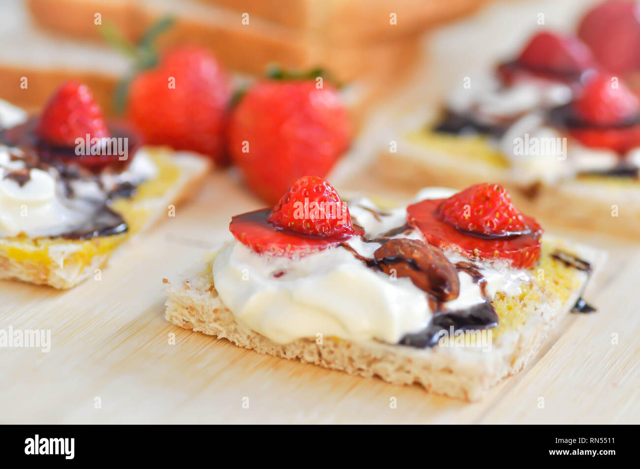 whole wheat bread and canape with strawberry topping Stock Photo - Alamy