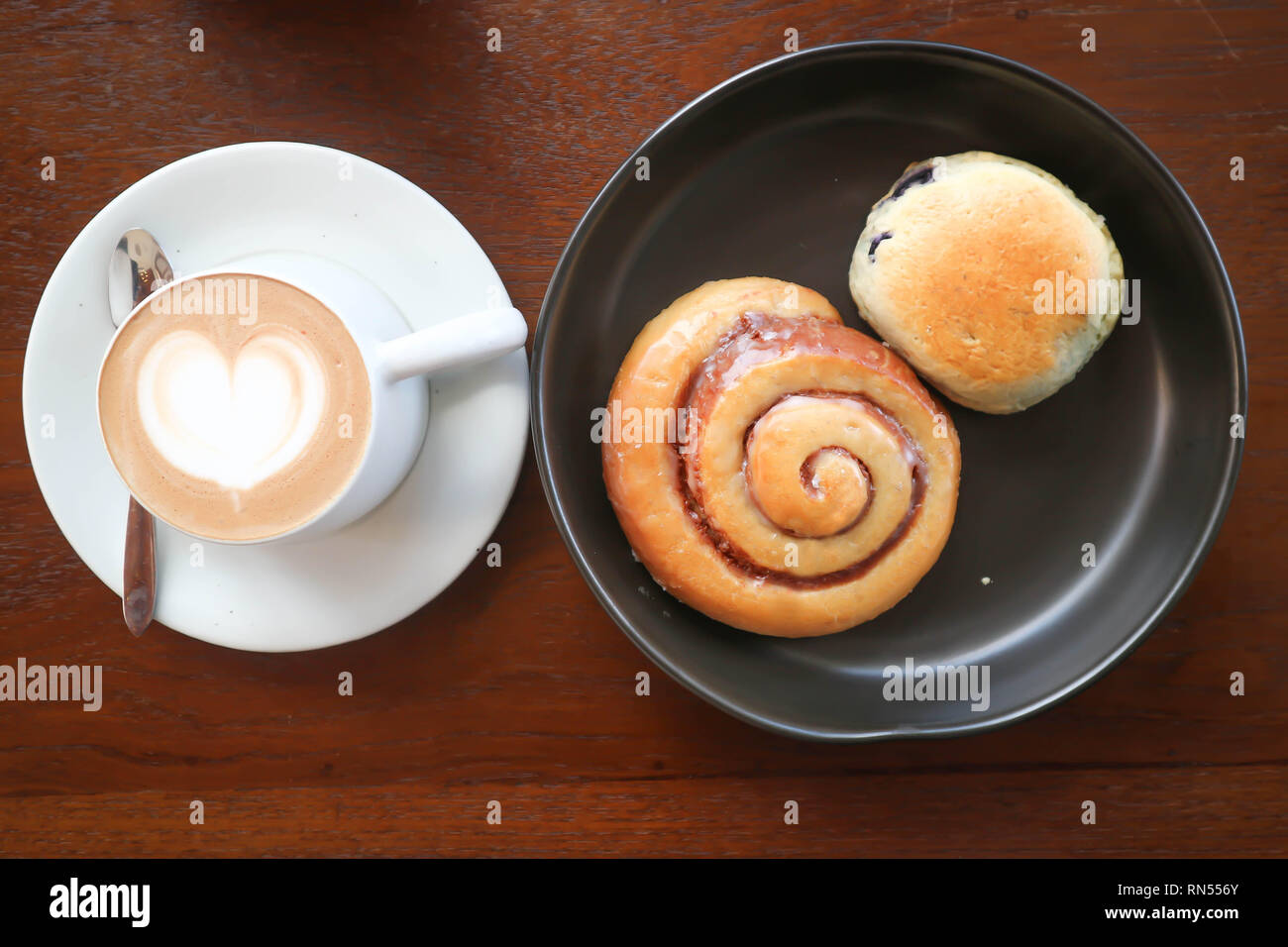 hot coffee and scone and danish pastry dish Stock Photo - Alamy