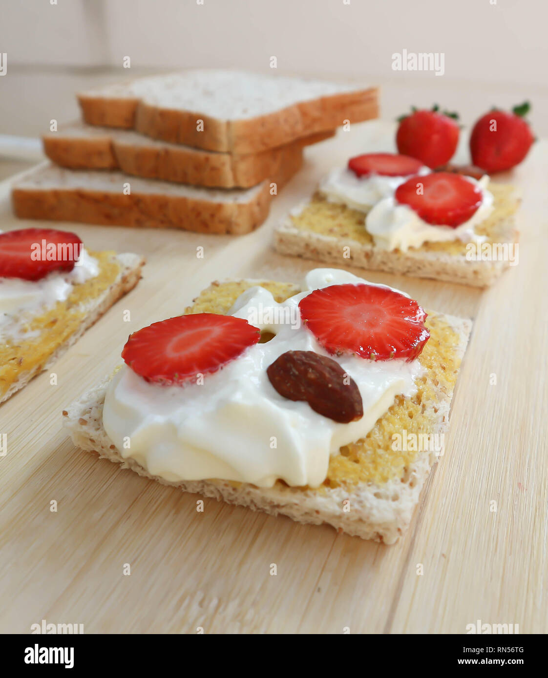 whole wheat bread and canape with strawberry topping Stock Photo - Alamy