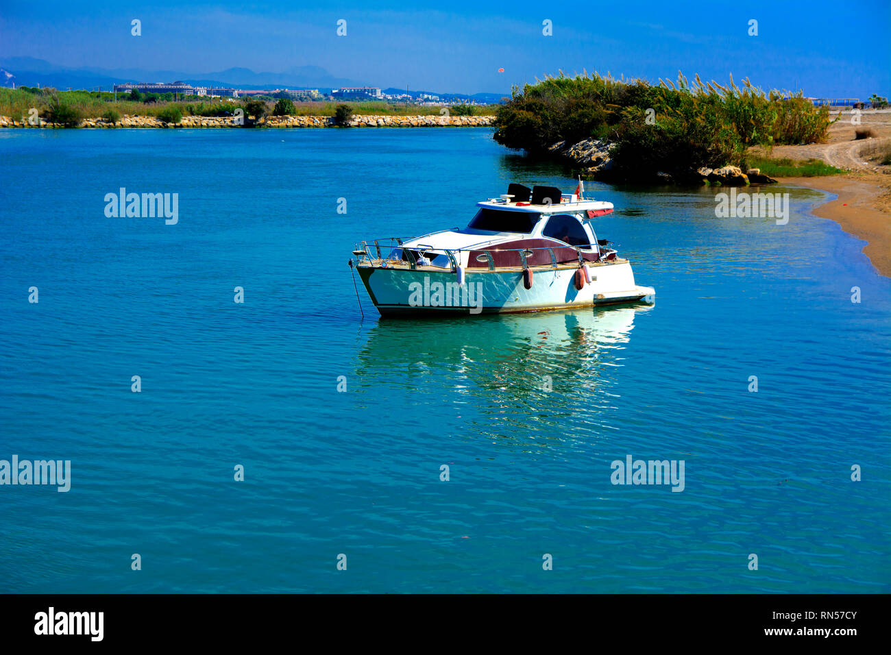 White speedboat on the background of the coast and blue sky. Photos of ...