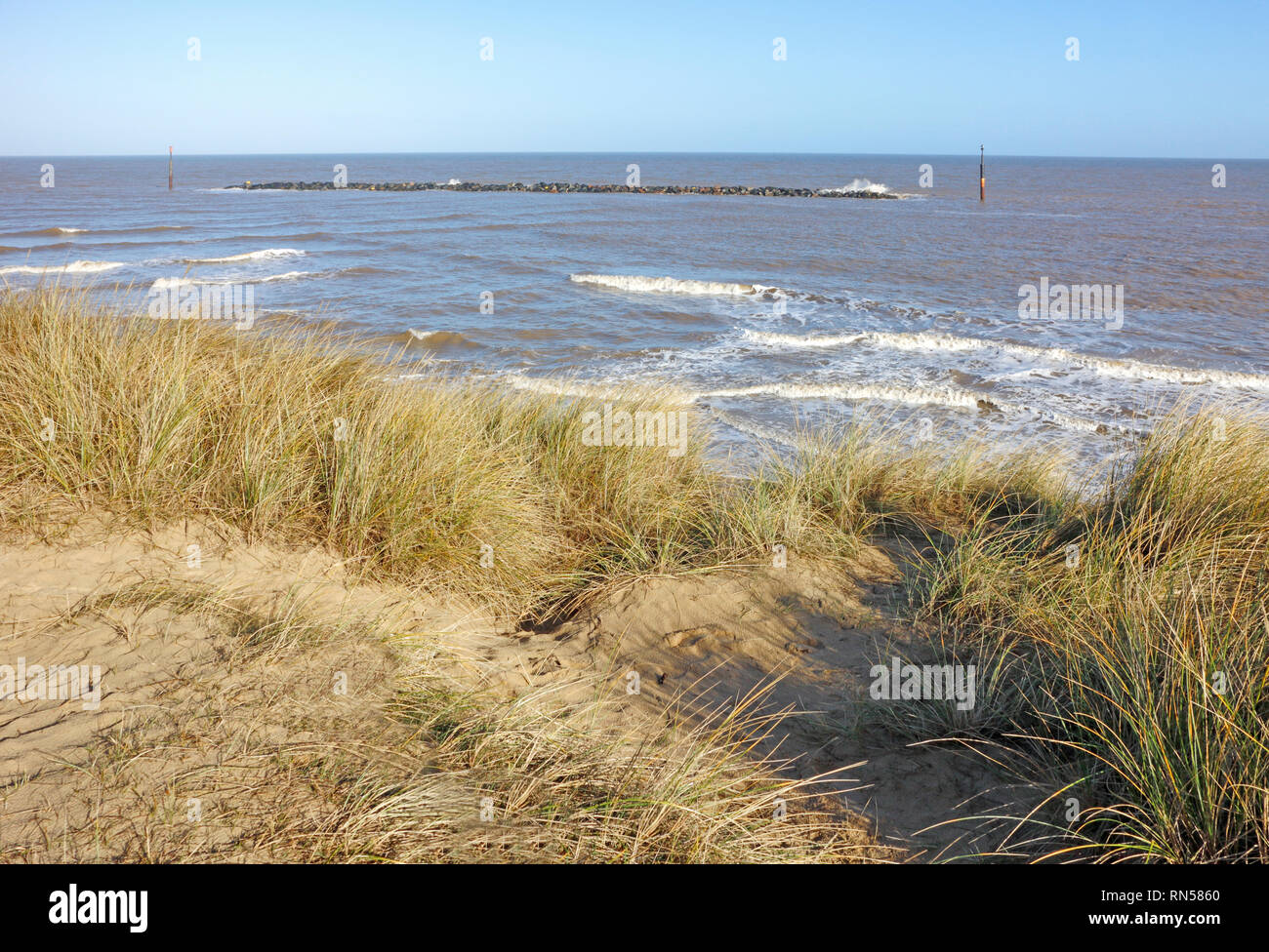A view from the sand dunes over the beach to the sea on the Norfolk ...