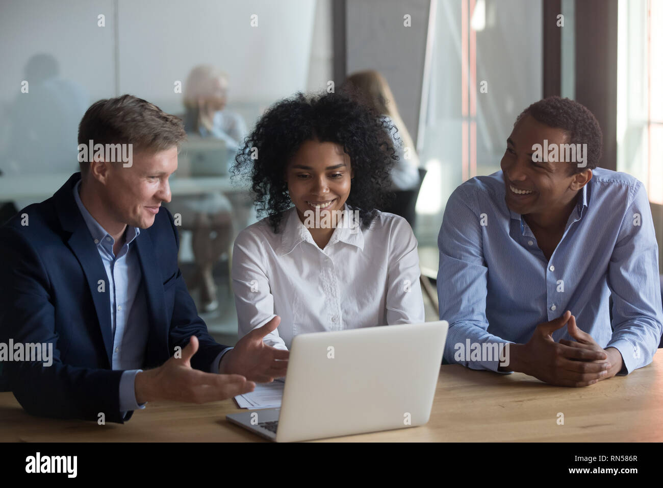 Three colleagues sitting business meeting hi-res stock photography and ...