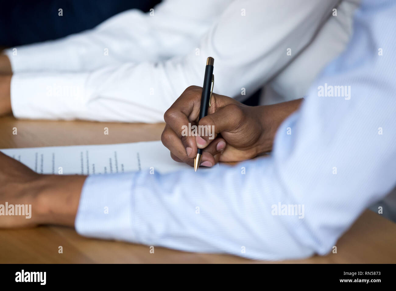 Black man putting signature affirm contract close up male hands Stock ...