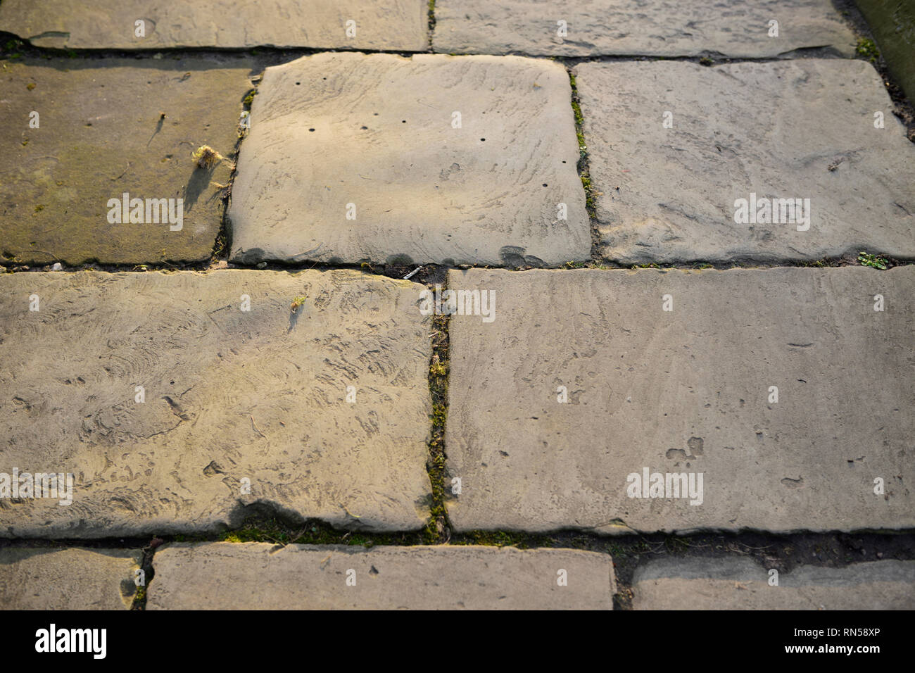 Stone flags forming footpath at all saints church stand in whitefield ...