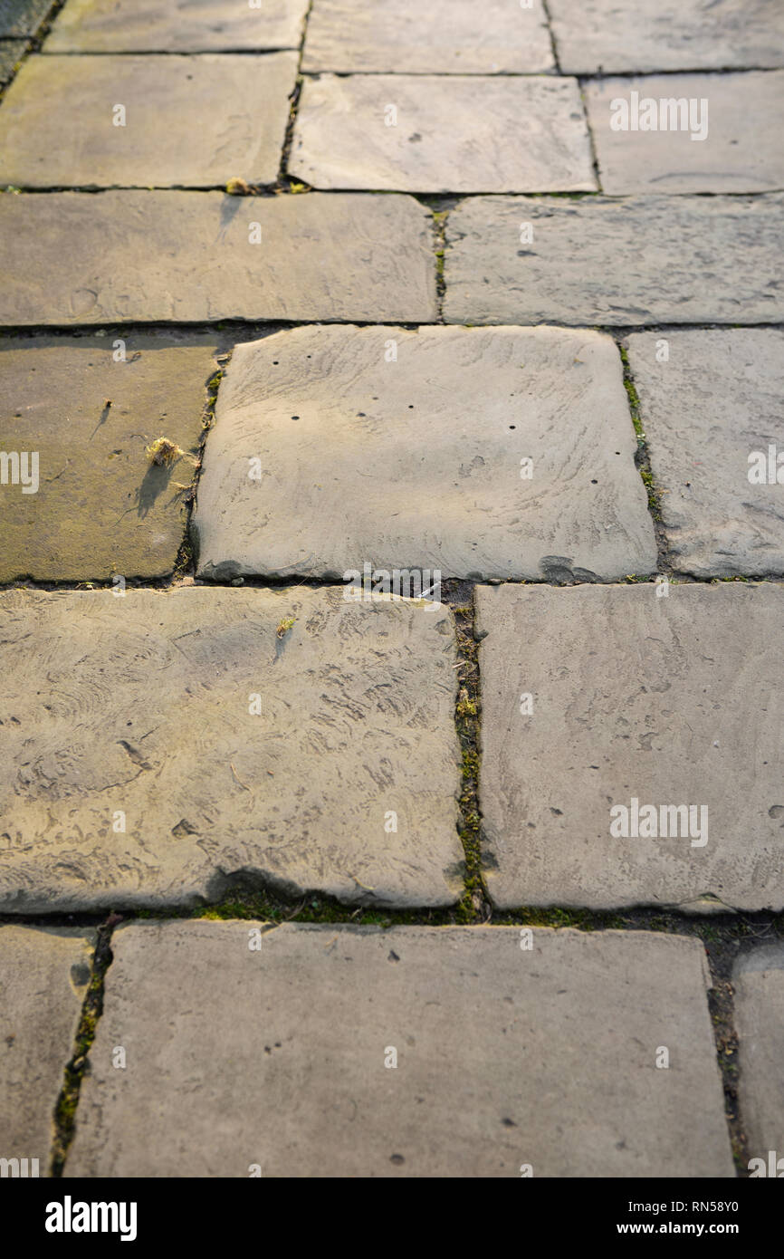 Stone flags forming footpath at all saints church stand in whitefield ...
