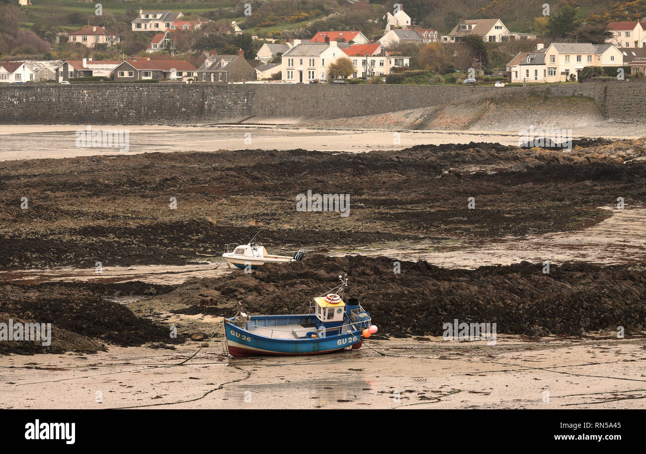 Tide out in a fishing village on the West Coast of Guernsey in the ...