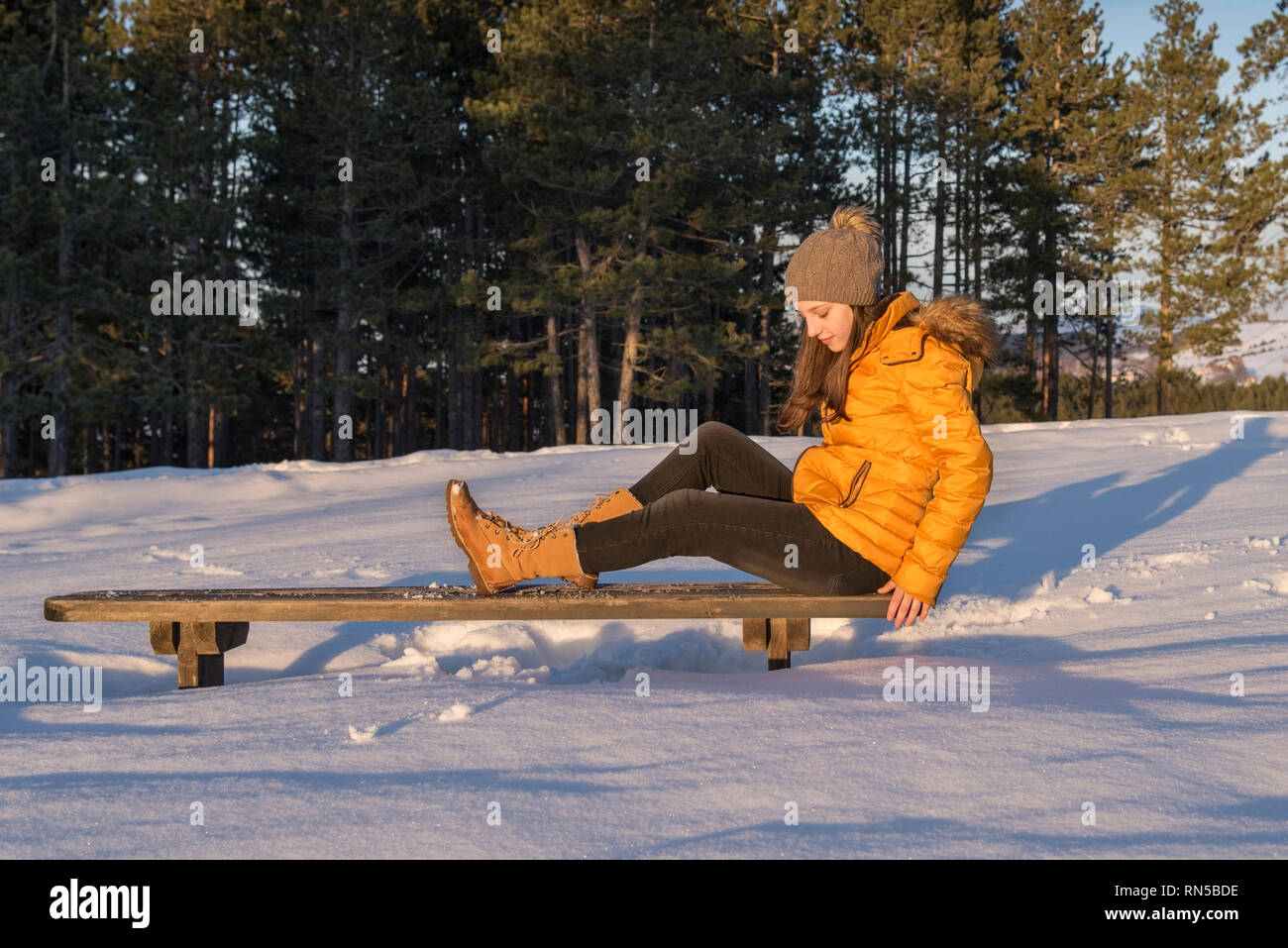 Beautiful girl modeling on snow Stock Photo - Alamy
