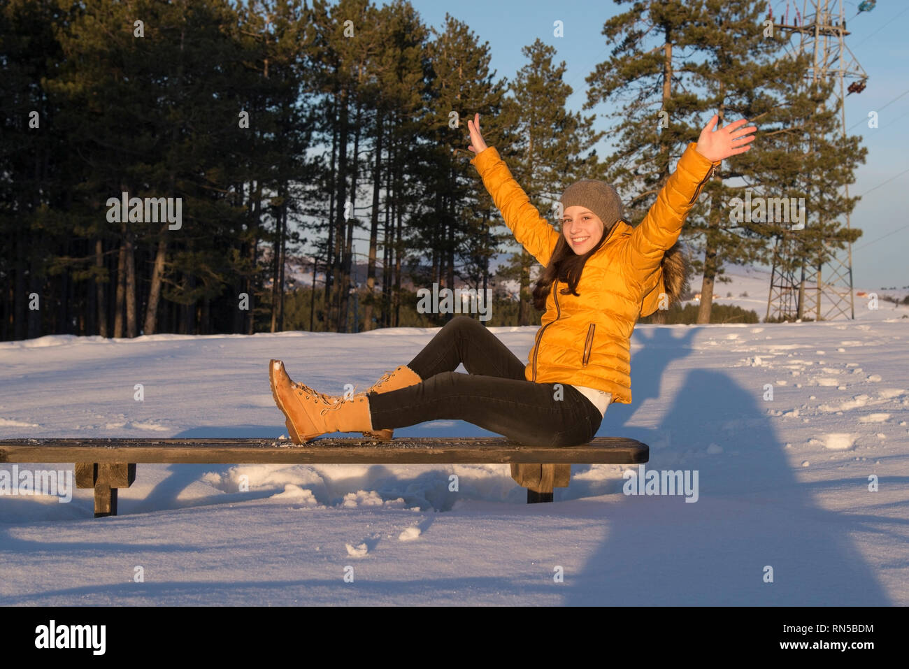 Beautiful girl modeling on snow Stock Photo - Alamy