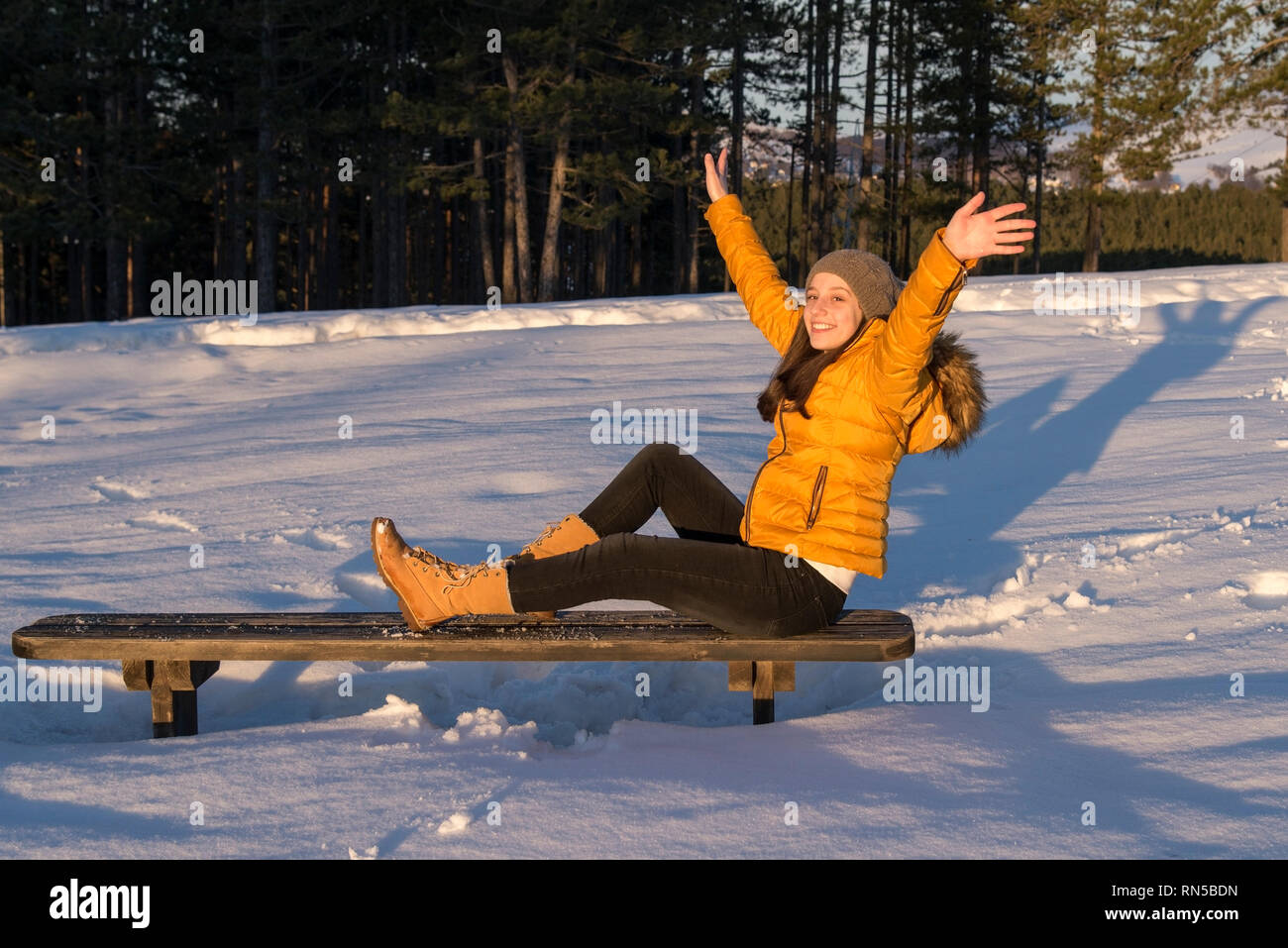 Beautiful girl modeling on snow Stock Photo - Alamy