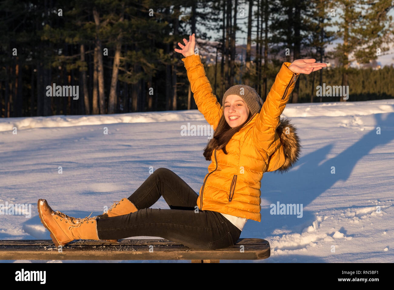 Beautiful girl modeling on snow Stock Photo - Alamy