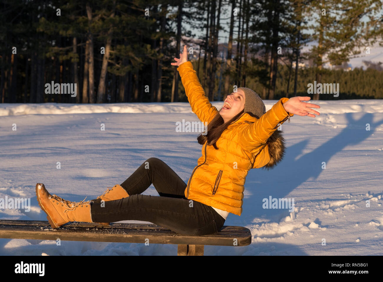 Beautiful girl modeling on snow Stock Photo - Alamy