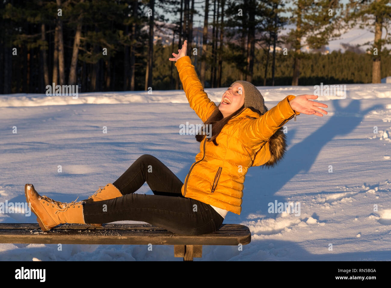Beautiful girl modeling on snow Stock Photo - Alamy