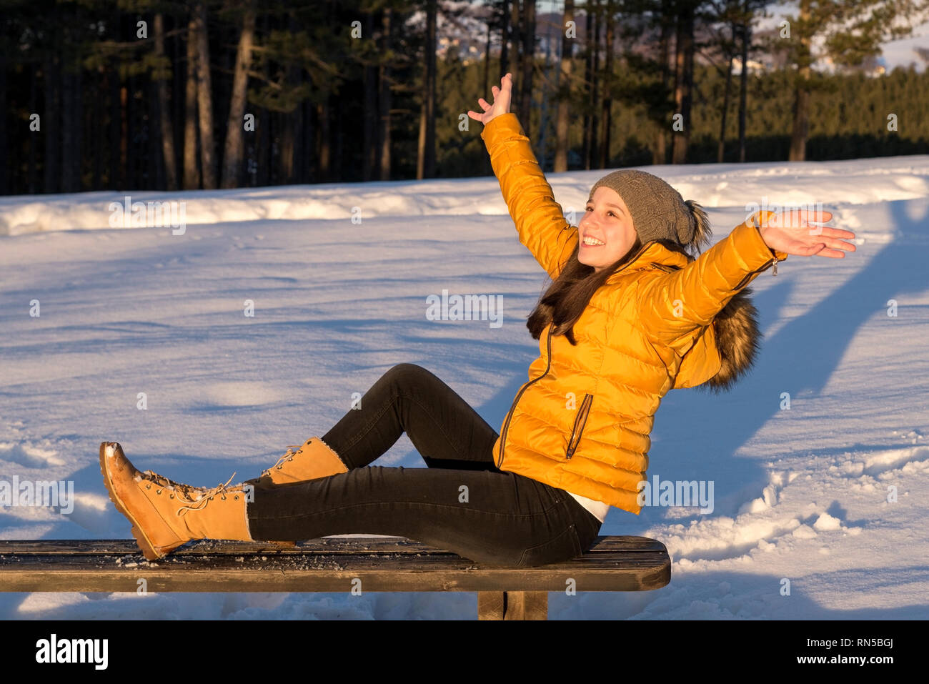 Beautiful girl modeling on snow Stock Photo - Alamy