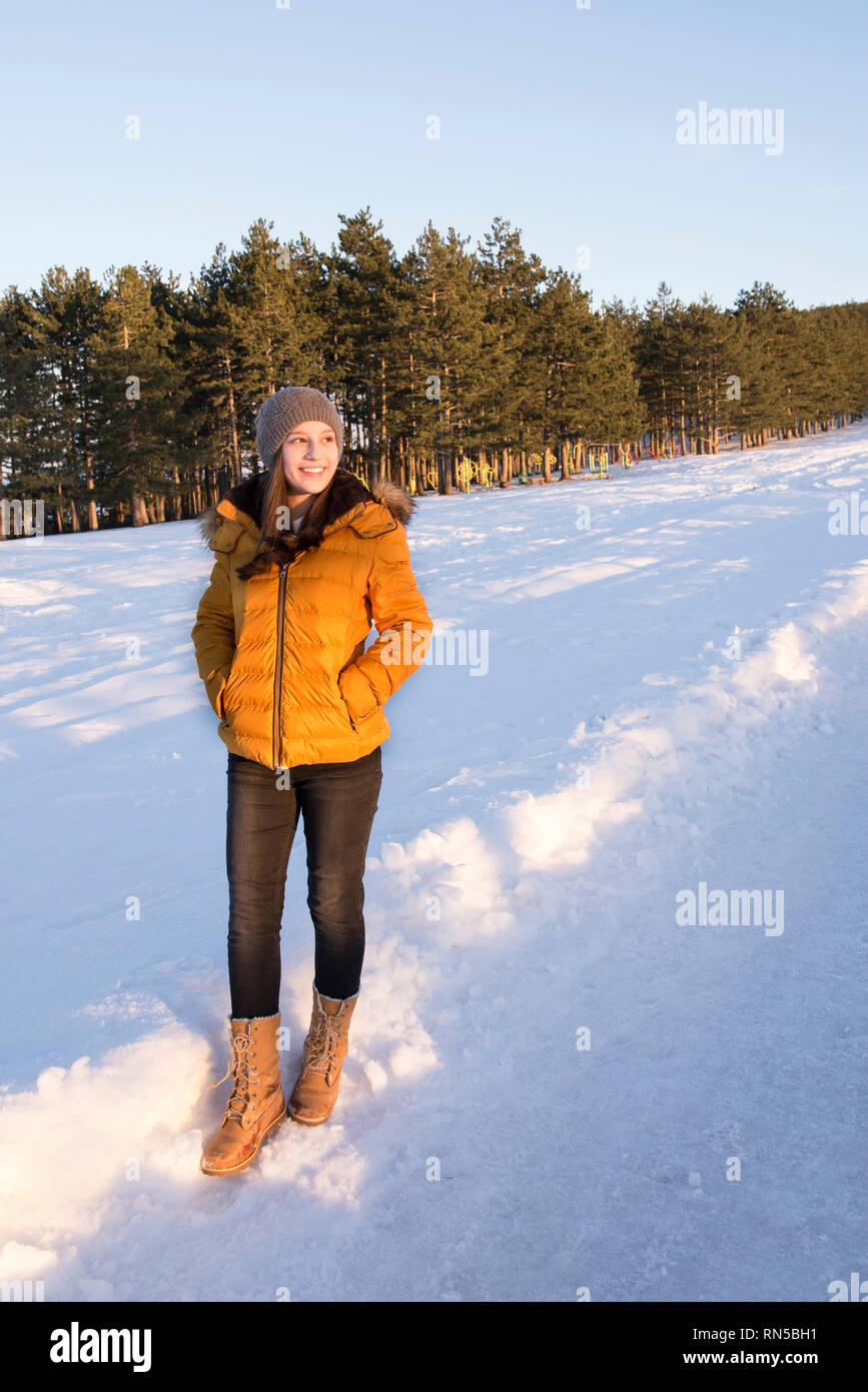 Beautiful girl modeling on snow Stock Photo - Alamy