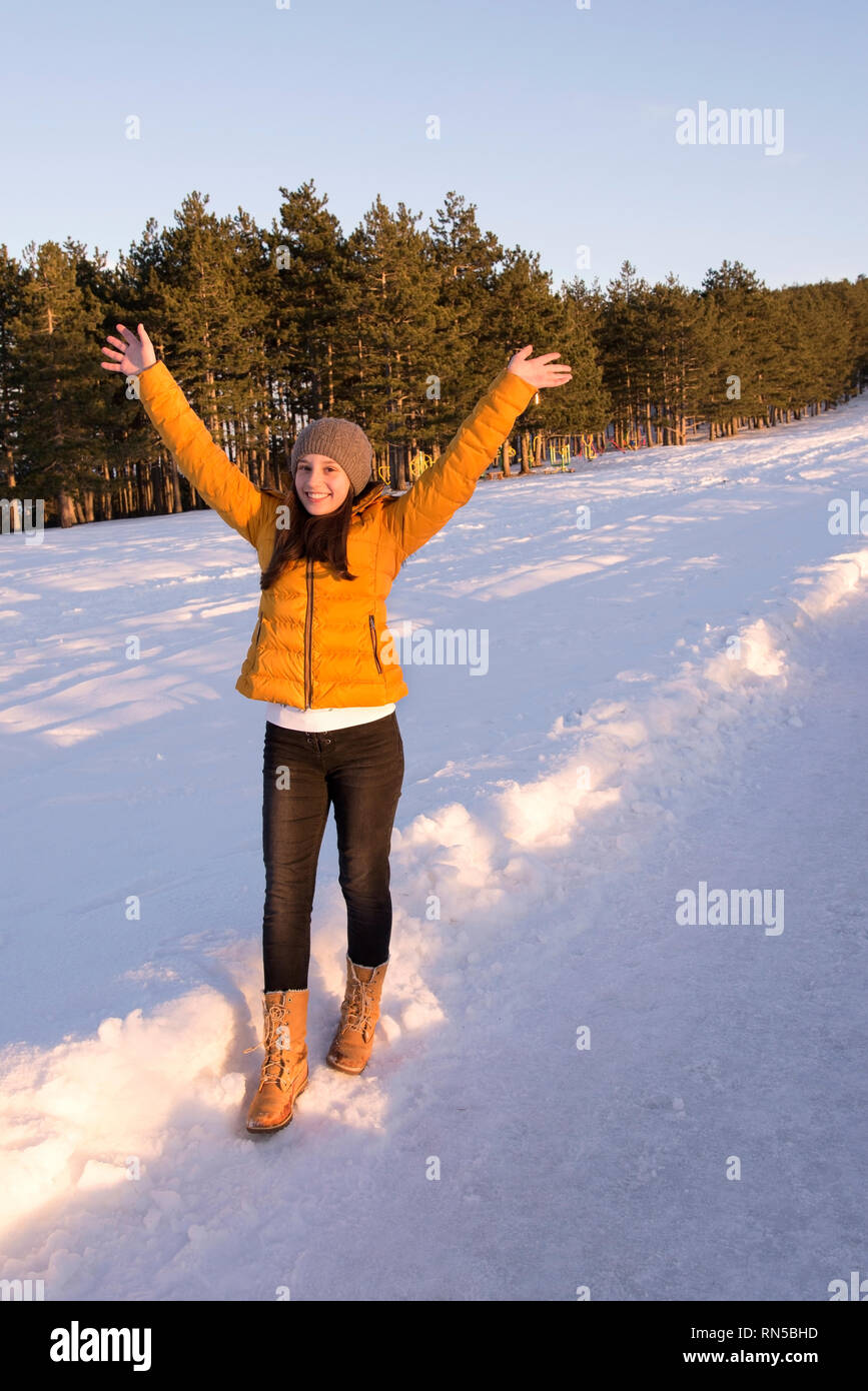 Beautiful girl modeling on snow Stock Photo - Alamy