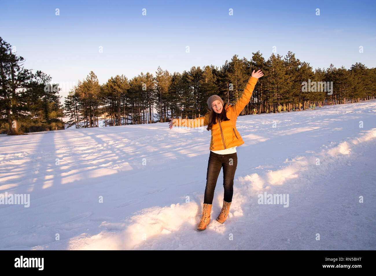 Beautiful girl modeling on snow Stock Photo - Alamy
