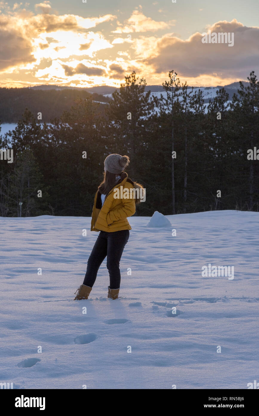 Beautiful girl modeling on snow Stock Photo - Alamy