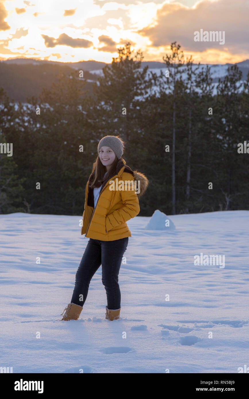 Beautiful girl modeling on snow Stock Photo - Alamy