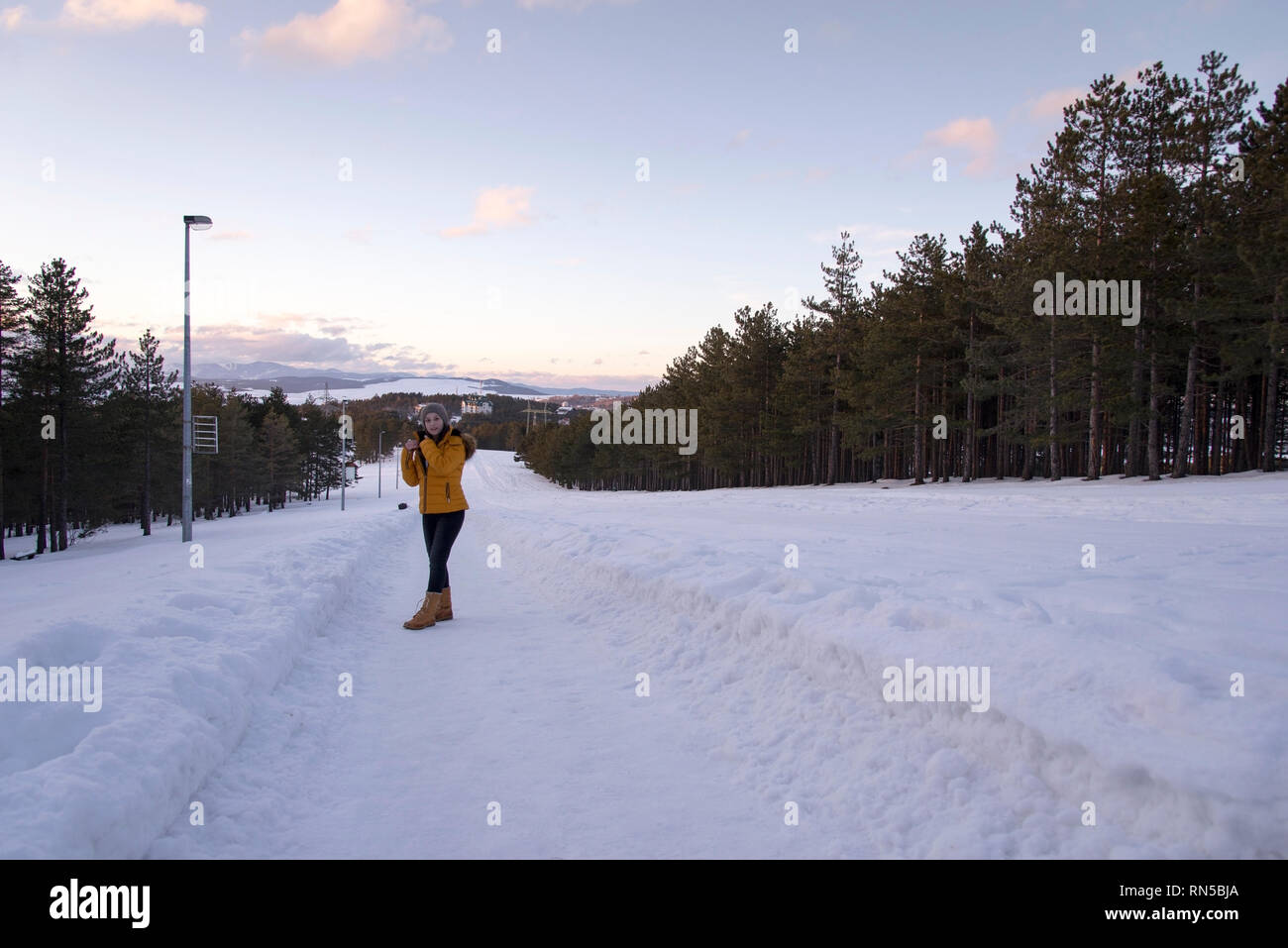 Beautiful girl modeling on snow Stock Photo - Alamy