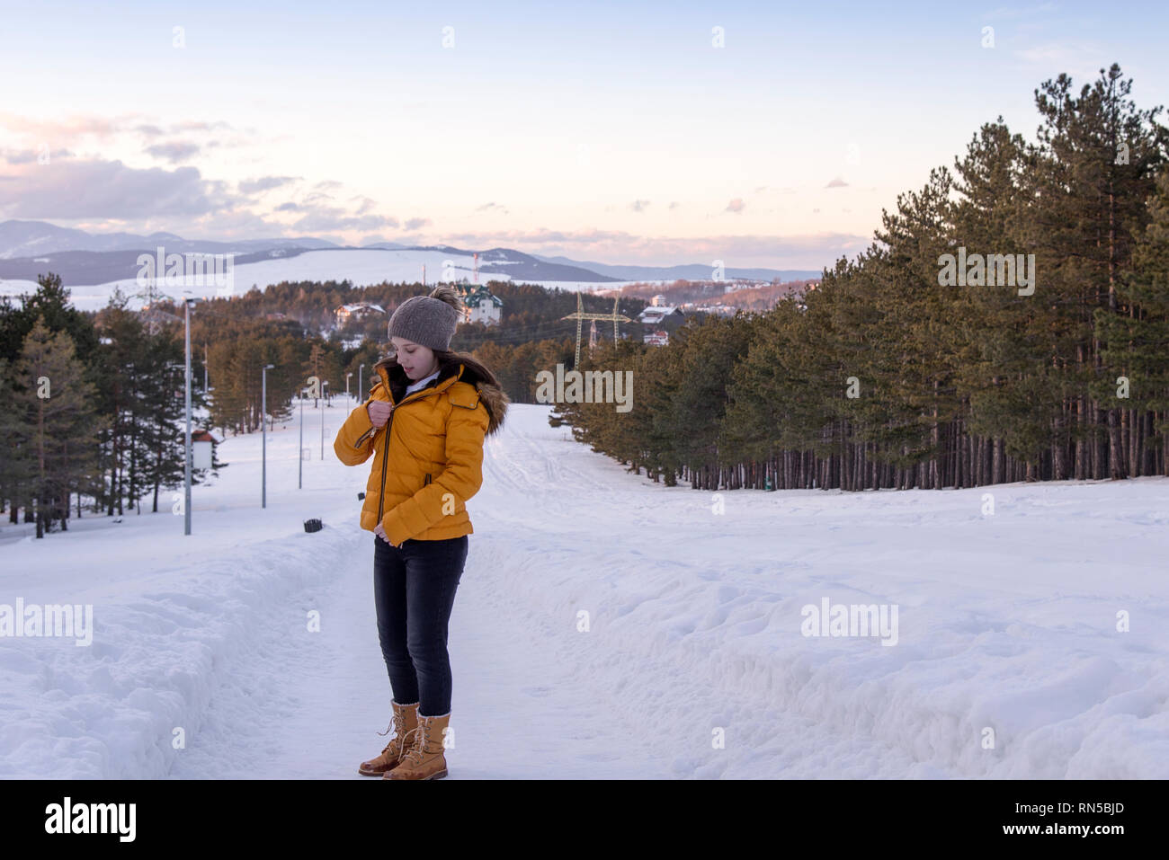 Beautiful girl modeling on snow Stock Photo - Alamy