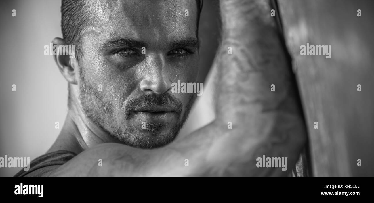 Handsome Caucasian Male Model Posing On The Beach wall Stock Photo - Alamy