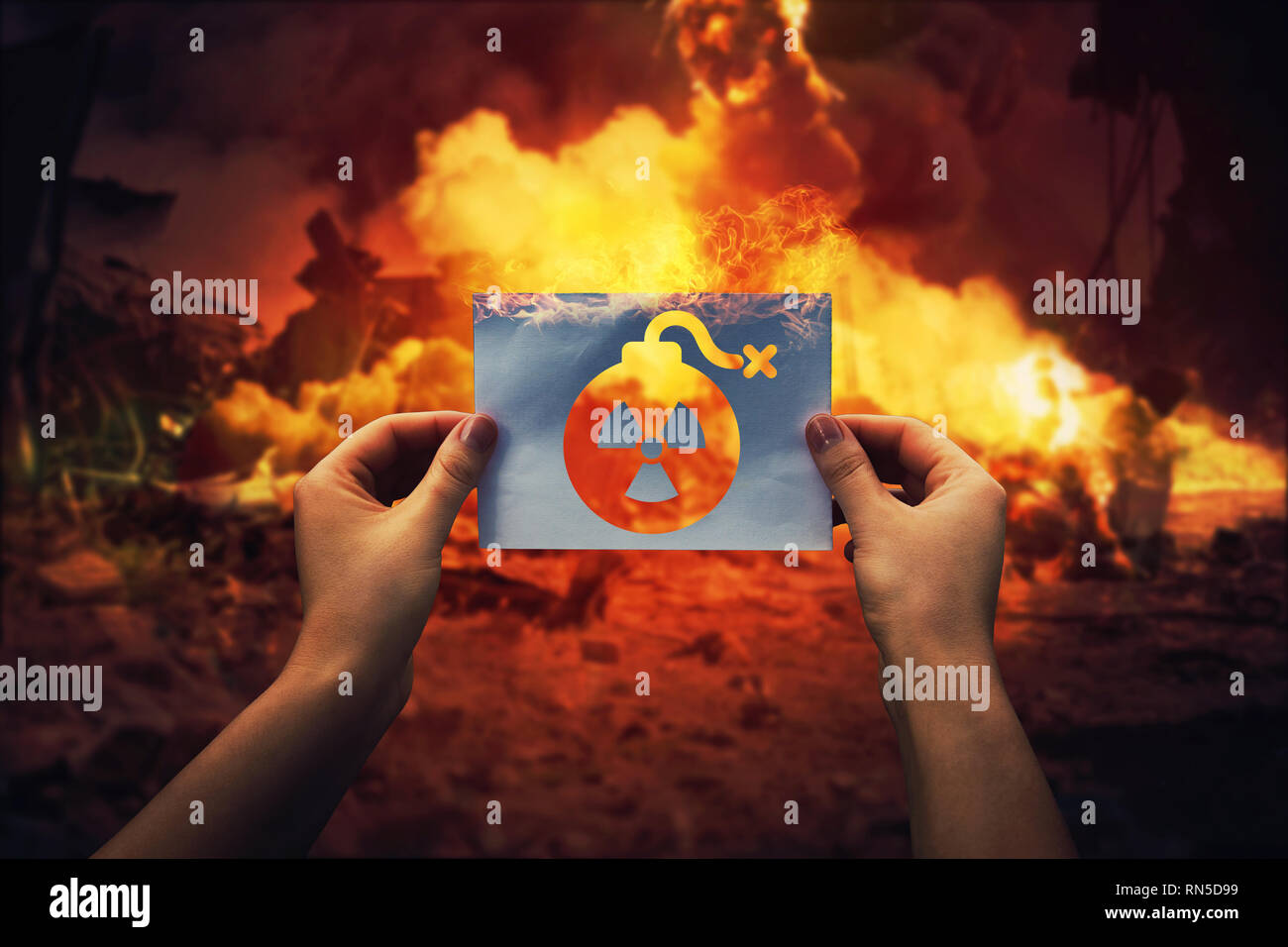 Terrorism and war global issue as human hand holding a paper sheet with ...